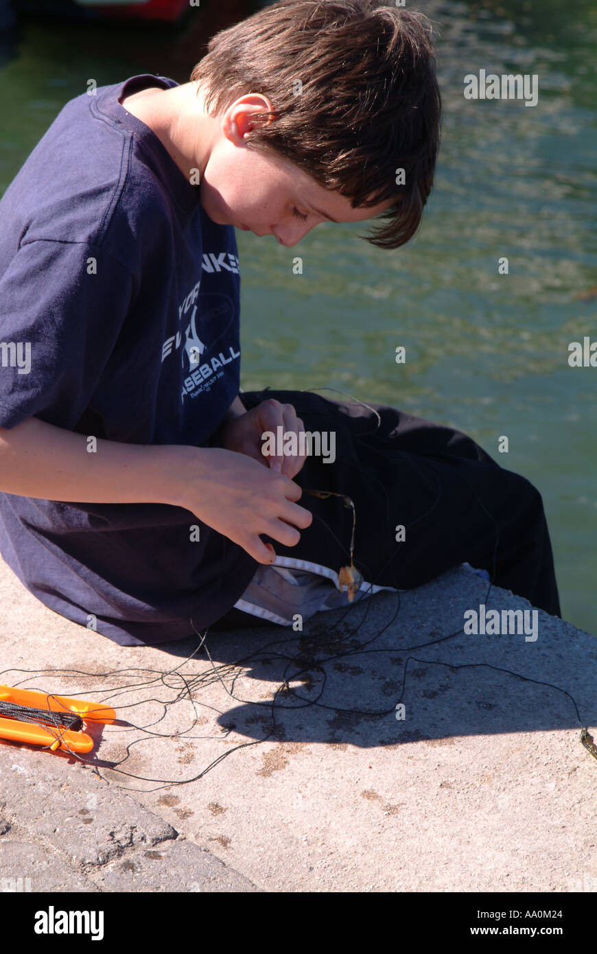 Children sitting on pier hi-res stock photography and images - Alamy