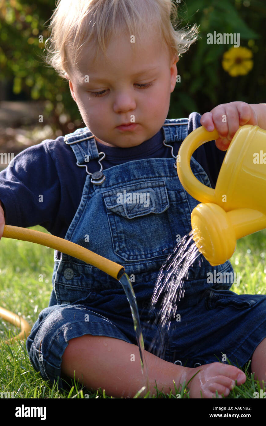 Child pouring water hi-res stock photography and images - Alamy