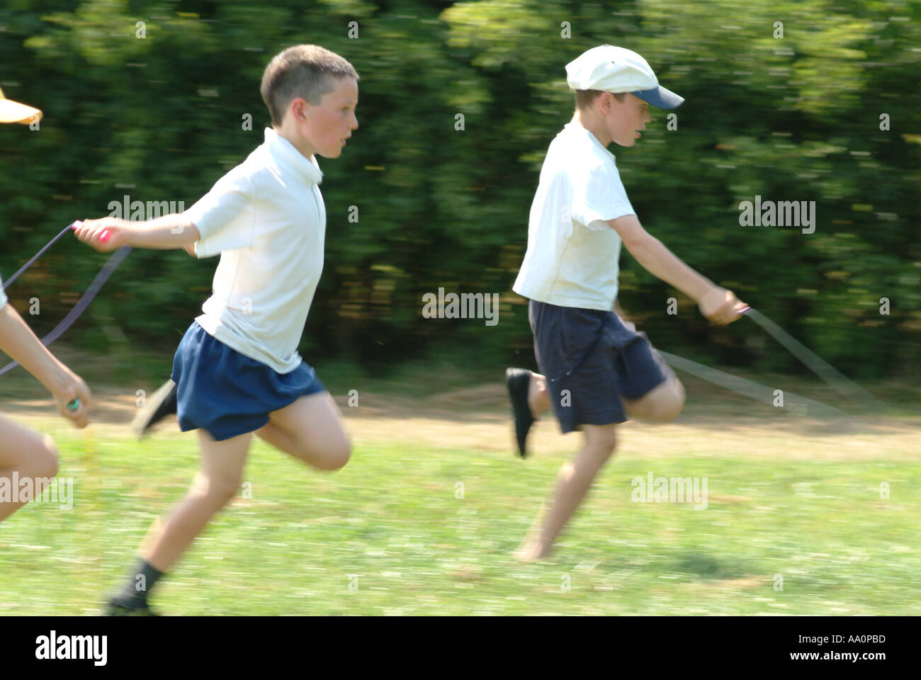 Boys competing in a skipping race Stock Photo - Alamy