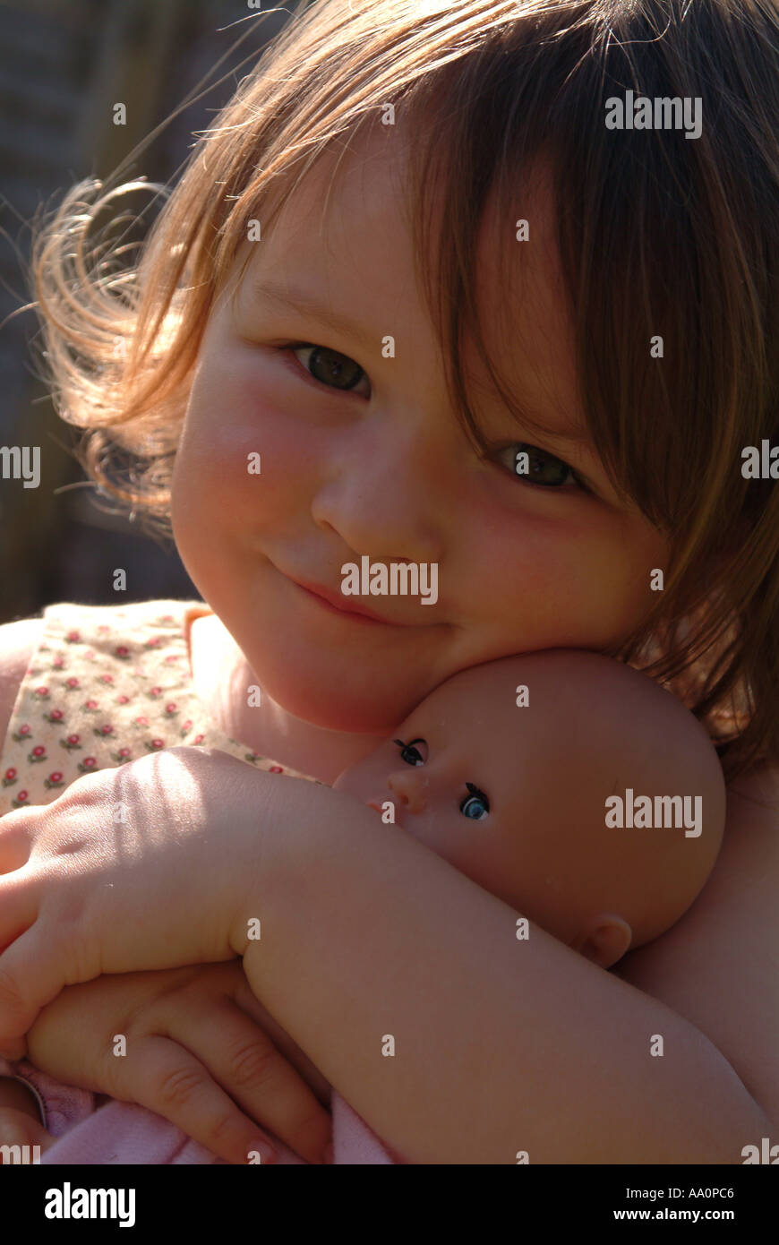 Cuddling a doll hi-res stock photography and images - Alamy