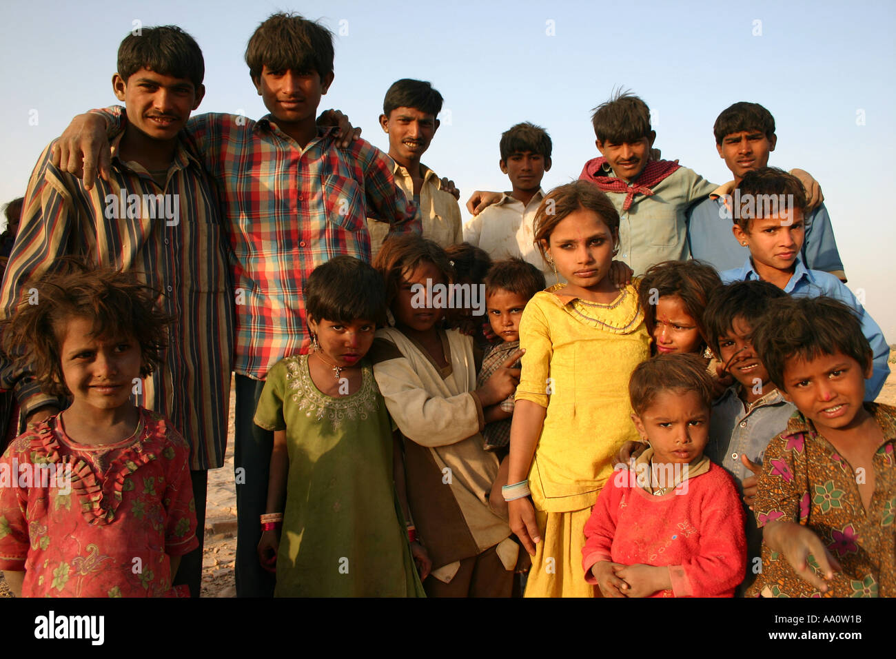 A Rajasthani gypsy community poses in the setting sun Stock Photo - Alamy