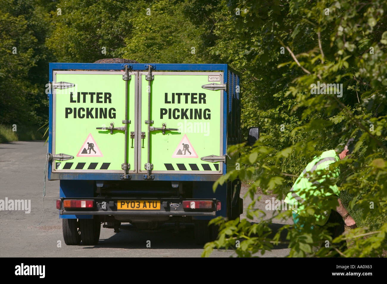 Highways dept litter picker clearing litter from the roadside Stock ...