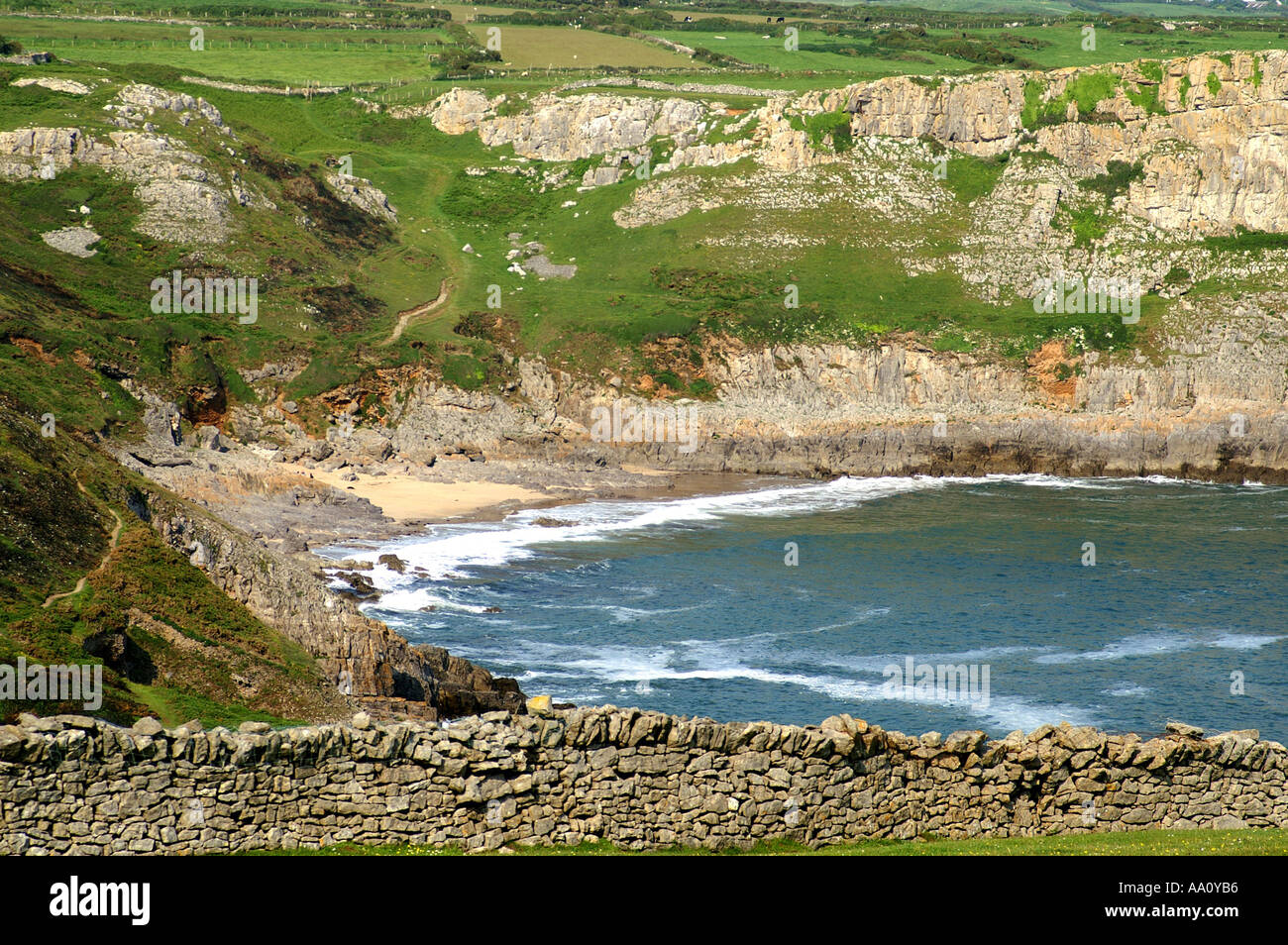 Dramatic limestone coastline at Worms Head The South Gower peninsula ...