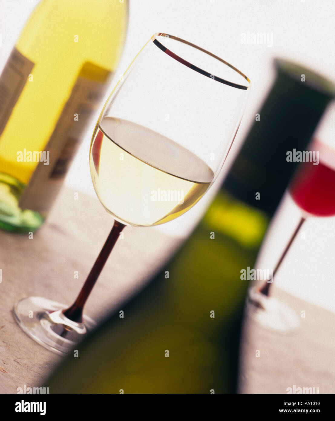 wine glasses and bottles shot at an angle Stock Photo - Alamy