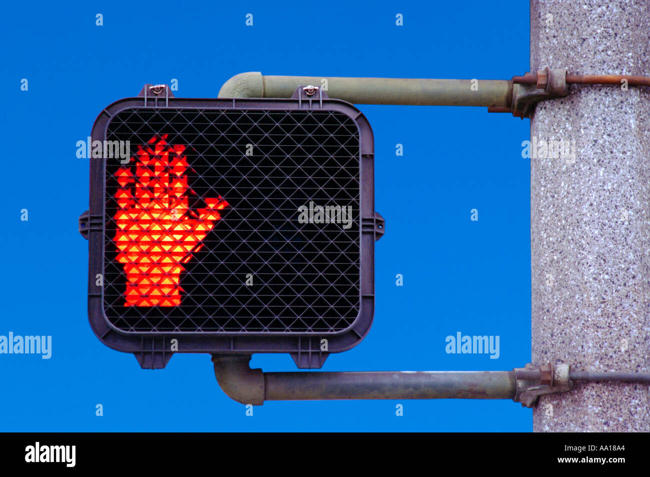 Traffic signal at crosswalk displaying the Don t Walk icon against a ... Traffic signal at crosswalk displaying the Don t Walk icon against a ...
