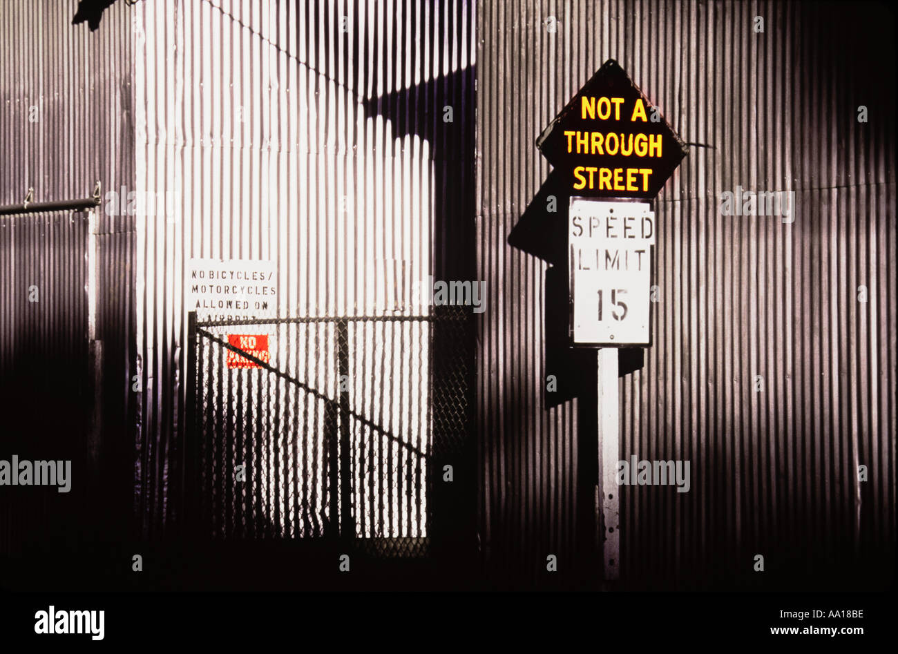 Alley with industrial buildings and sign Not A Through Street Stock ...