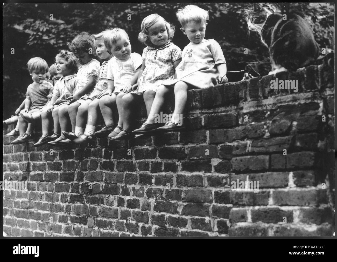 Shoes on wall Black and White Stock Photos & Images - Alamy
