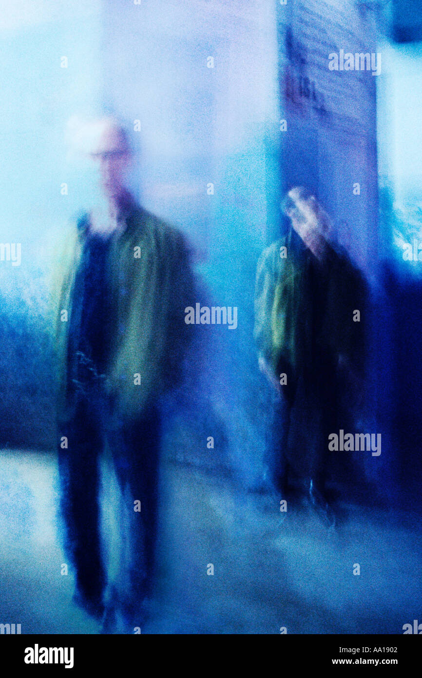 Double exposure of man walking at night Stock Photo - Alamy