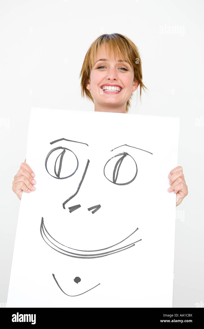 Woman holding drawing Stock Photo - Alamy