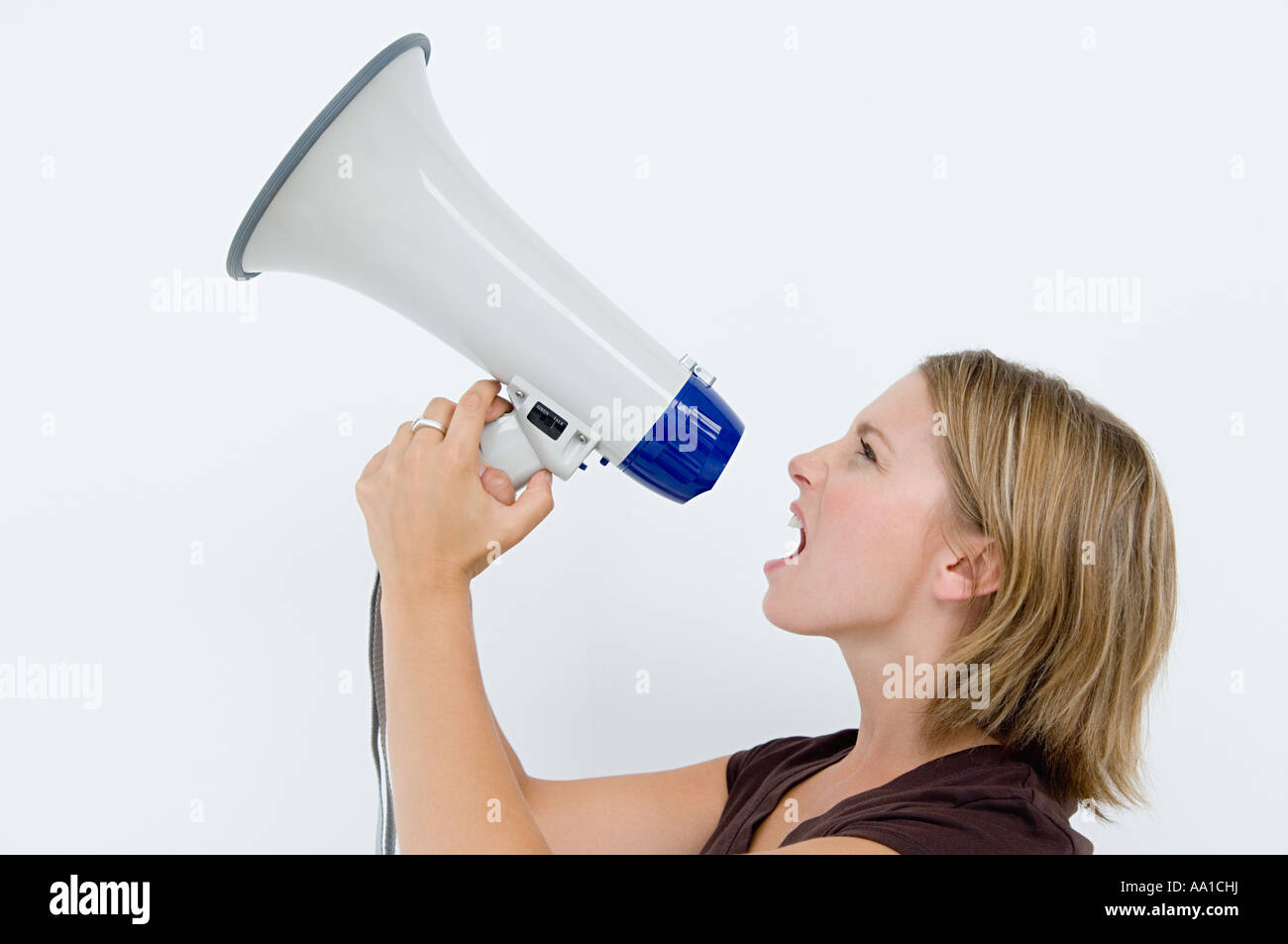 Woman using loudspeaker Stock Photo - Alamy