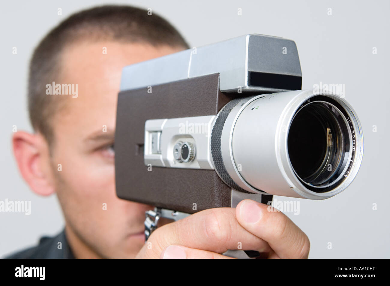 Man using cine camera Stock Photo - Alamy