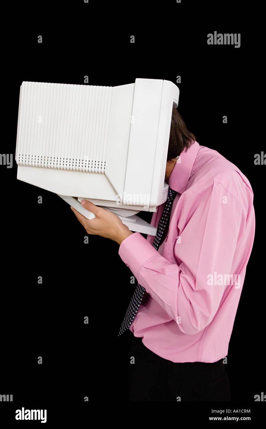 Man with head inside computer monitor Stock Photo - Alamy