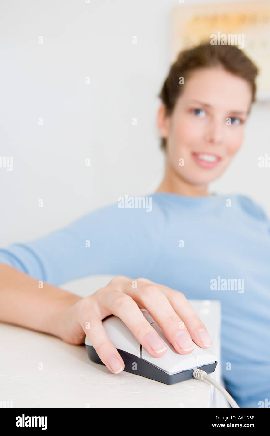 Woman using computer mouse Stock Photo - Alamy