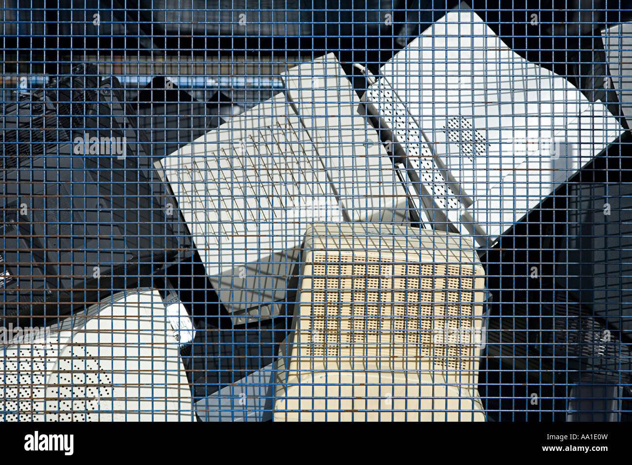 Computer monitors and televisions in a skip Stock Photo - Alamy