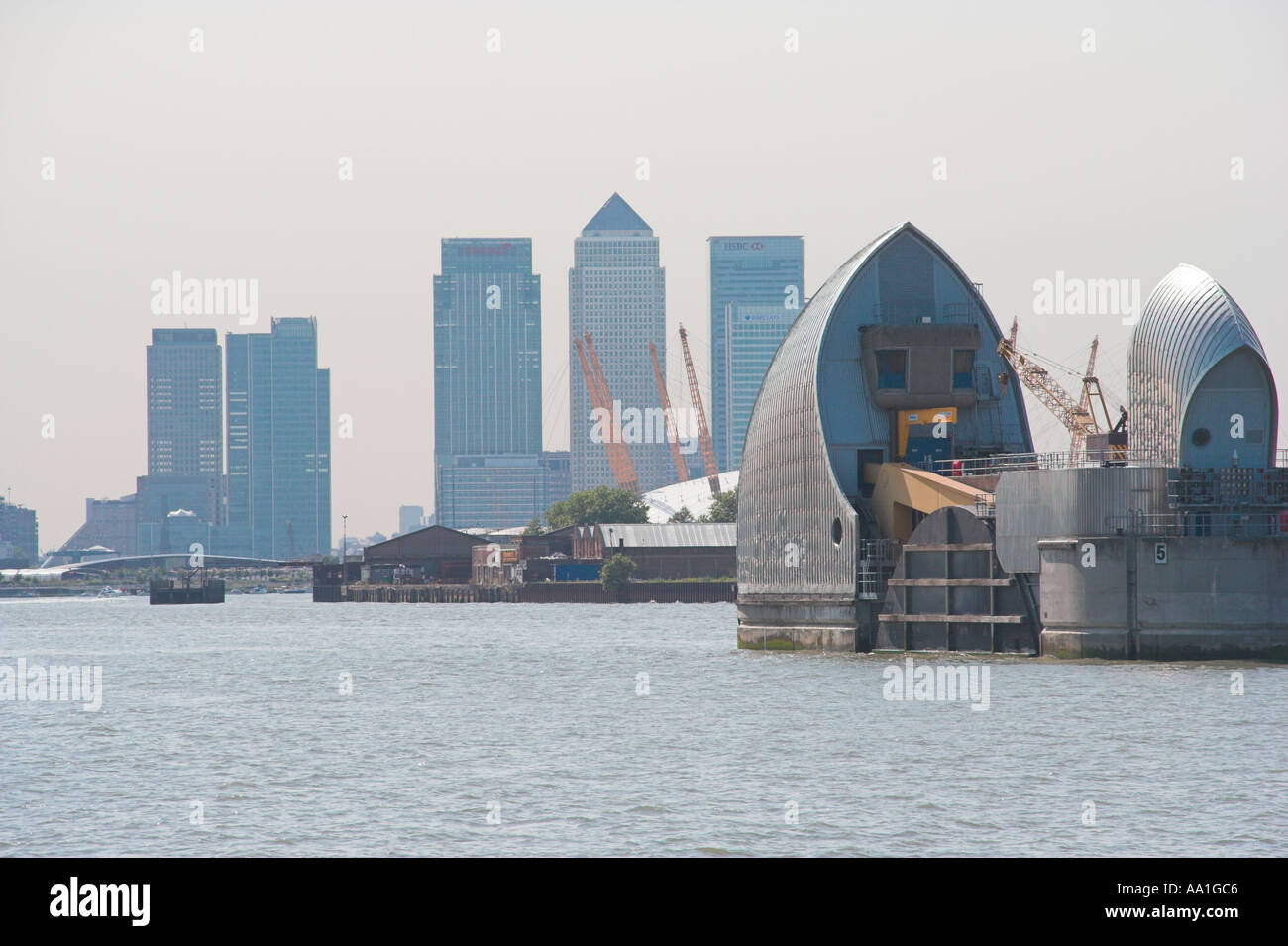 The Thames Flood Barrier in Greenwich London England and Canary Wharf ...