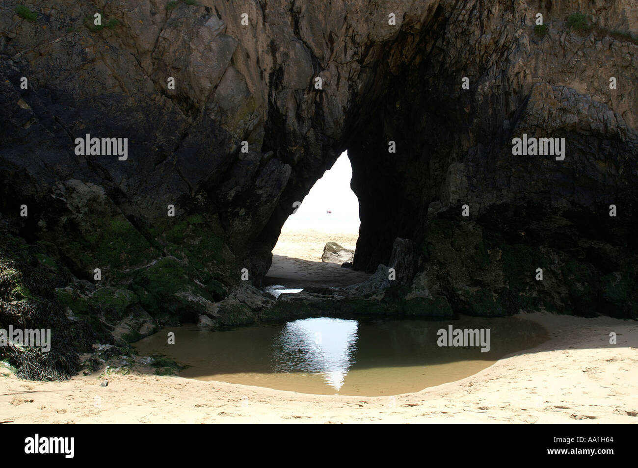 Hole through cliff Pobble beach Mumbles South Gower peninsula Glamorgan ...