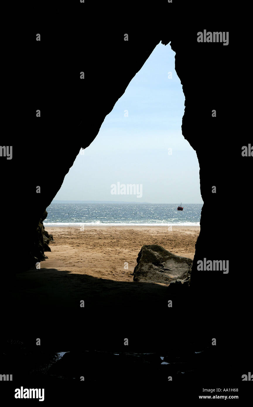 Hole through cliff Pobble beach Mumbles South Gower peninsula Glamorgan ...