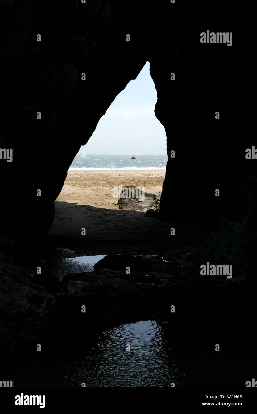 Hole through cliff Pobble beach Mumbles South Gower peninsula Glamorgan ...
