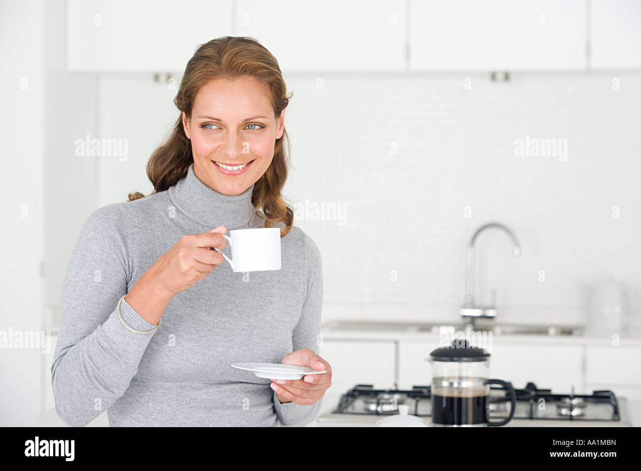 Woman having coffee Stock Photo - Alamy
