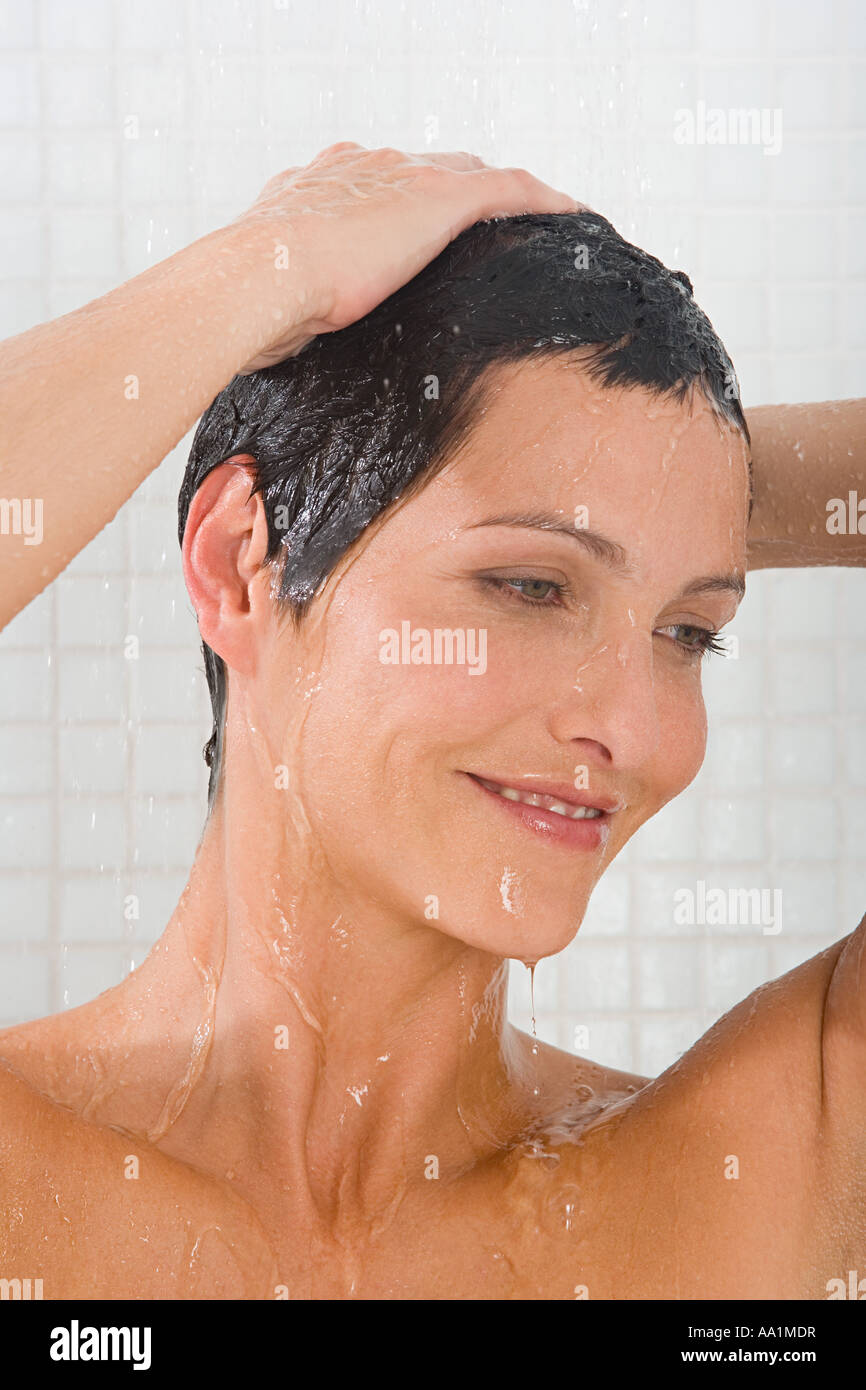 Mid adult woman shower home hi-res stock photography and images - Alamy