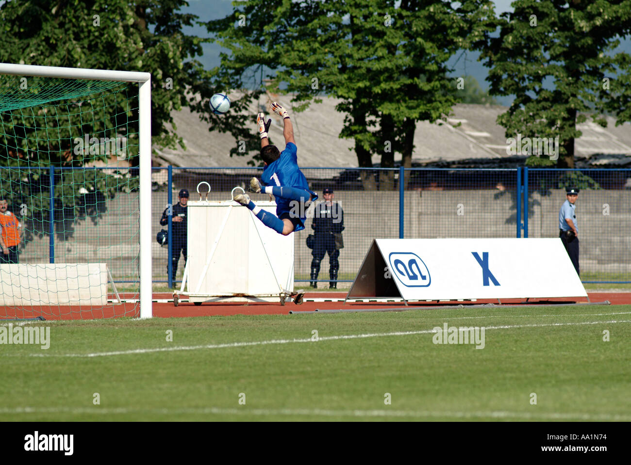 Goalkeeper Diving Through the Air to Make a Save at a Football Match ...