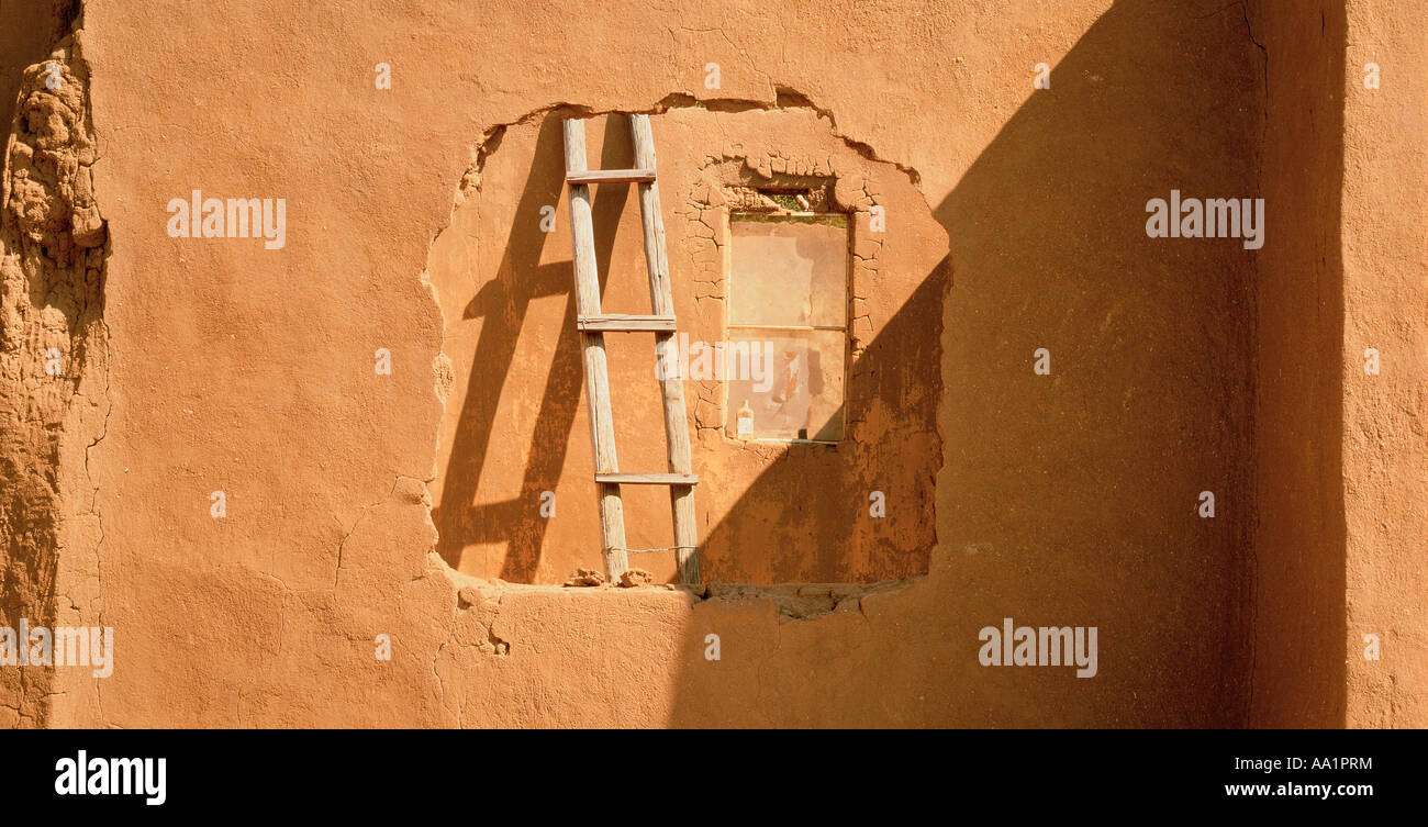 Ladder in Window of Ruined Mud House Stock Photo - Alamy