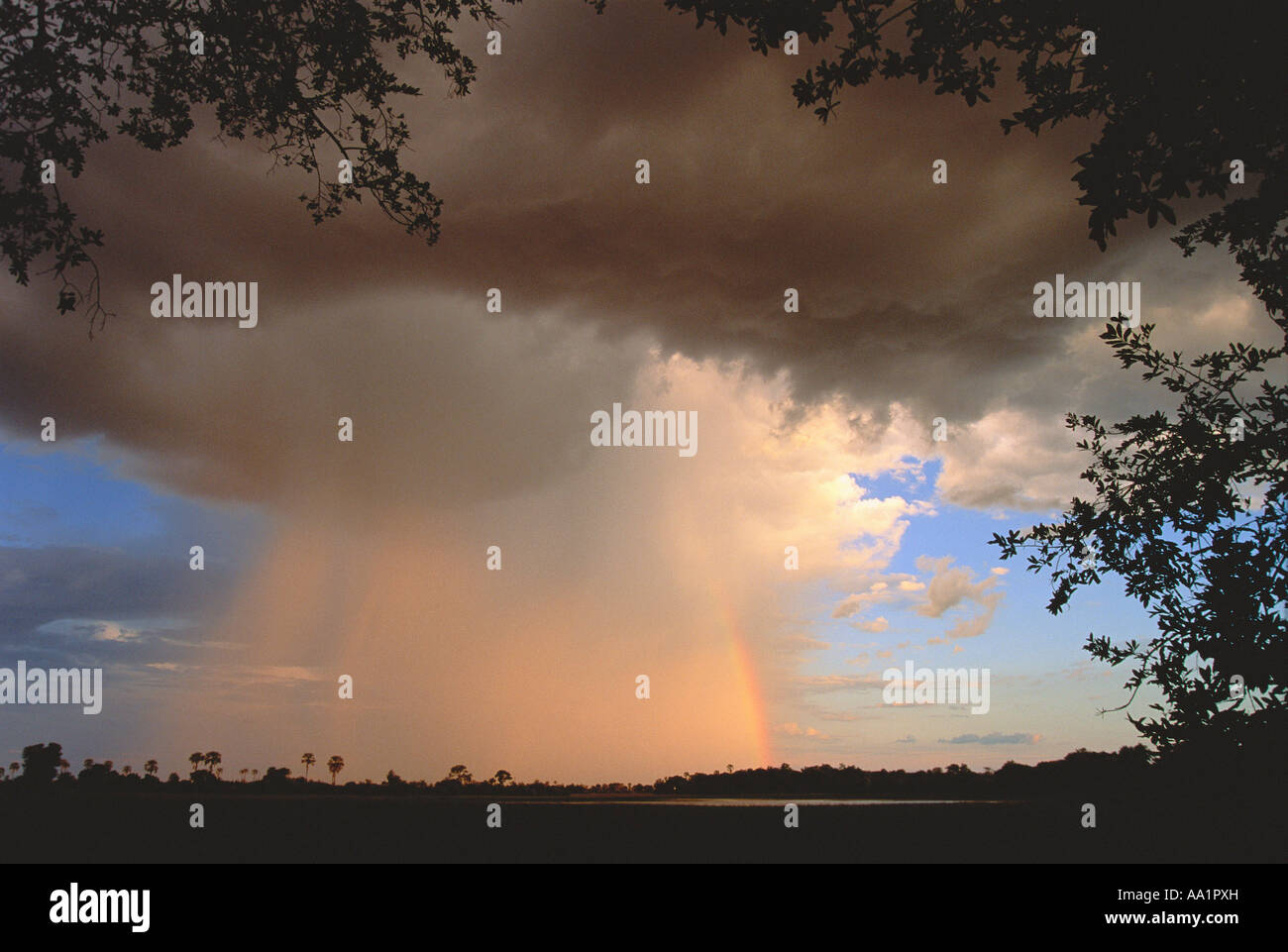 Storm Cloud and Rainbow Stock Photo - Alamy