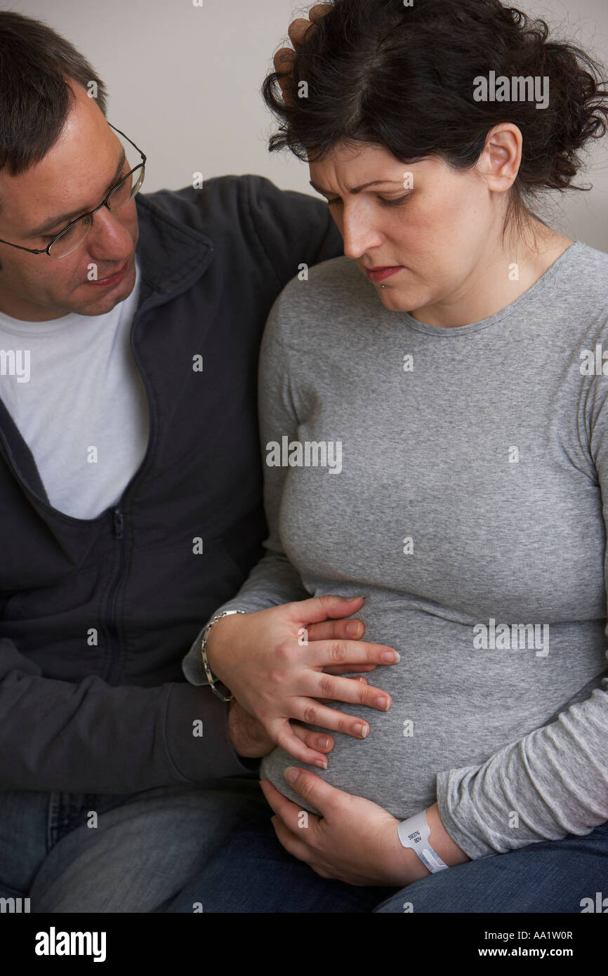 Husband comforting wife in labor hi-res stock photography and images ...