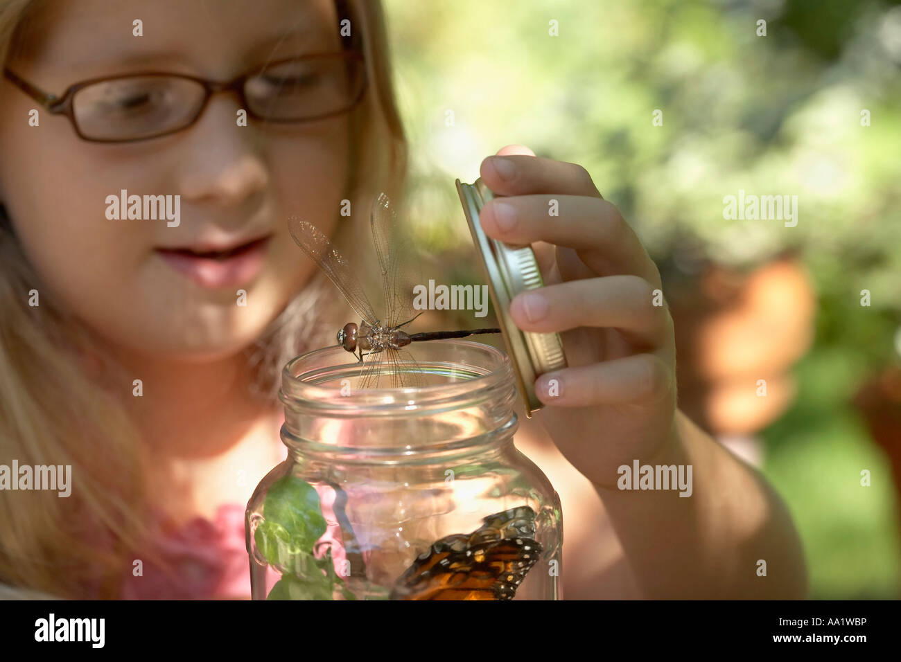 Girl with Jar of Bugs Stock Photo - Alamy