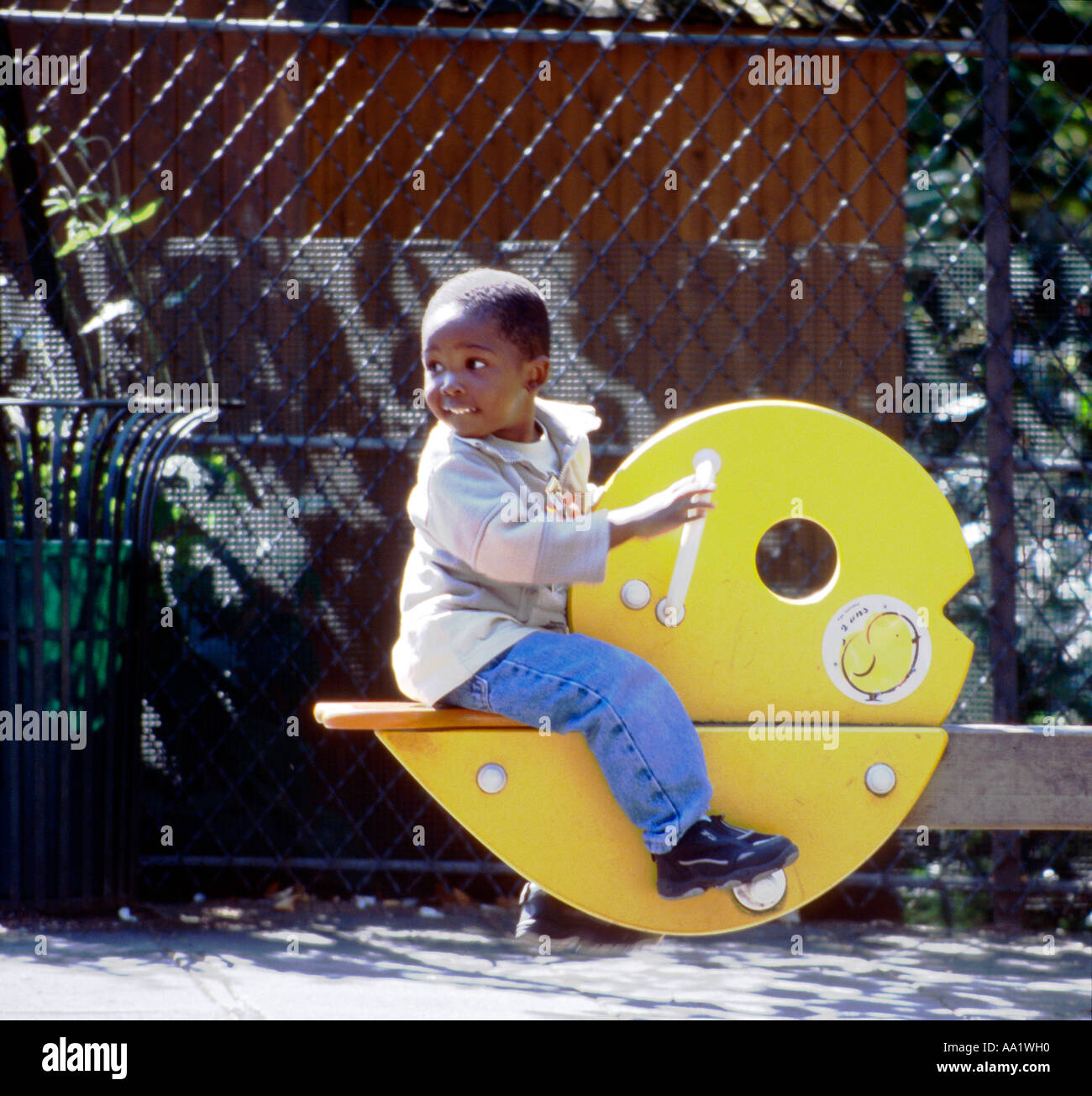 France, Paris, boy (4-5) on swing Stock Photo - Alamy