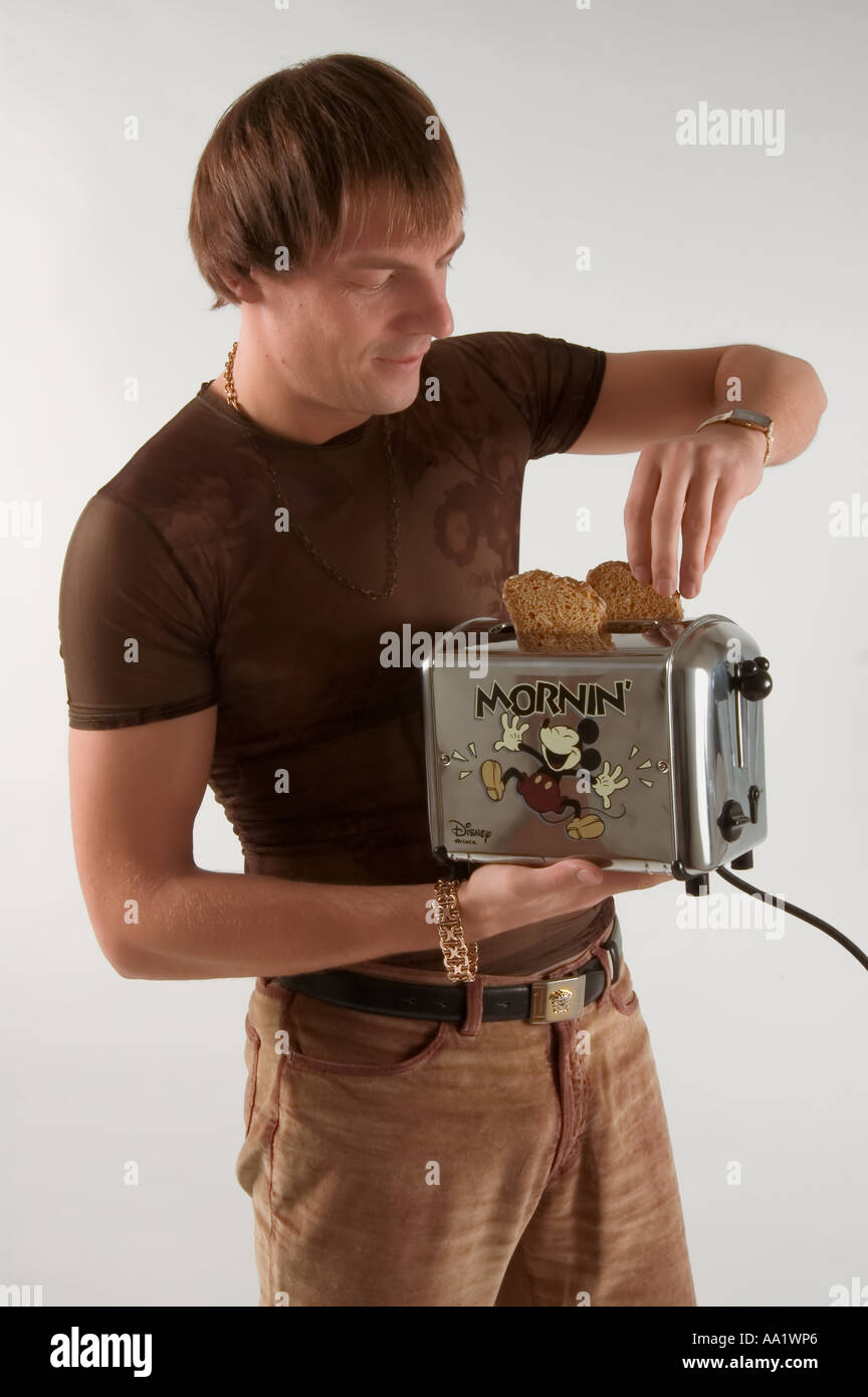 A man standing with toaster in his hands Stock Photo - Alamy