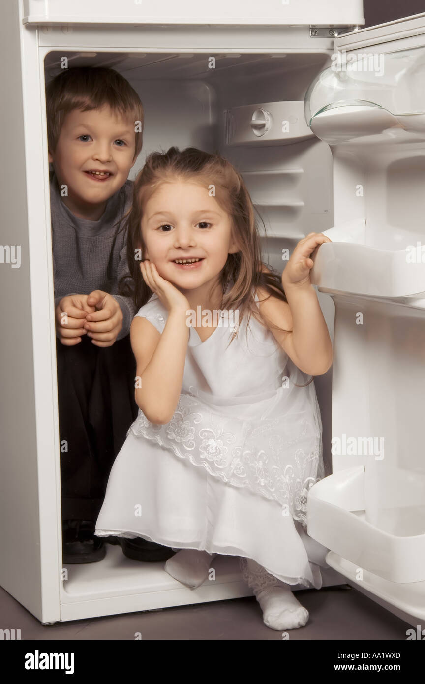 Children in the refrigerator Stock Photo - Alamy