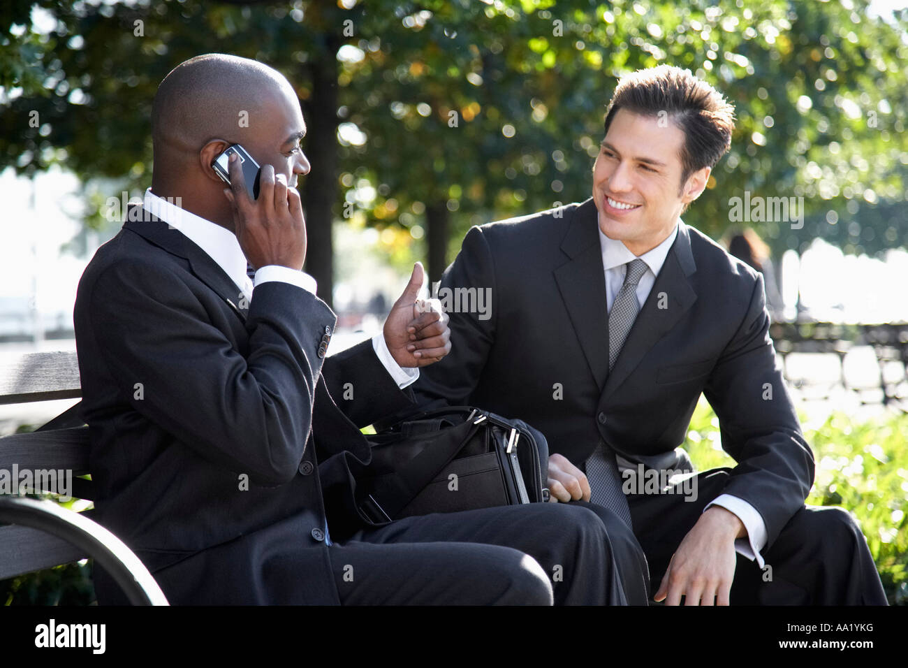 Businessmen Talking Outdoors Stock Photo - Alamy