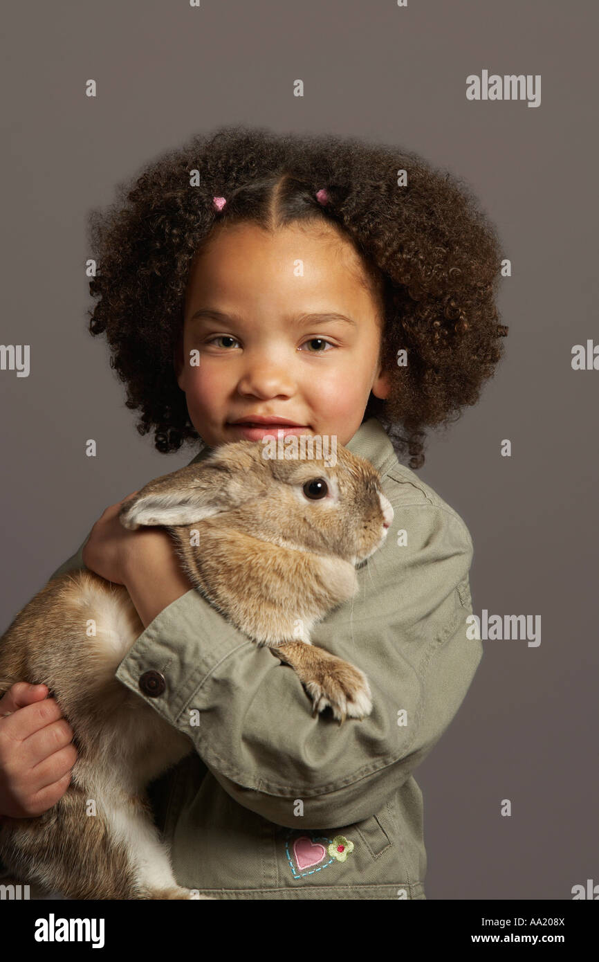 Portrait of Girl Holding Rabbit Stock Photo - Alamy