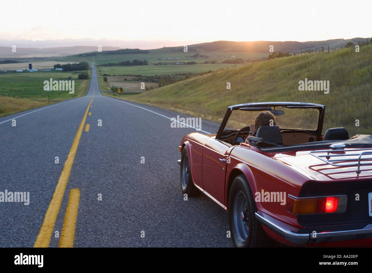 Woman Driving on Rural Highway, Black Diamond, Alberta, Canada Stock ...
