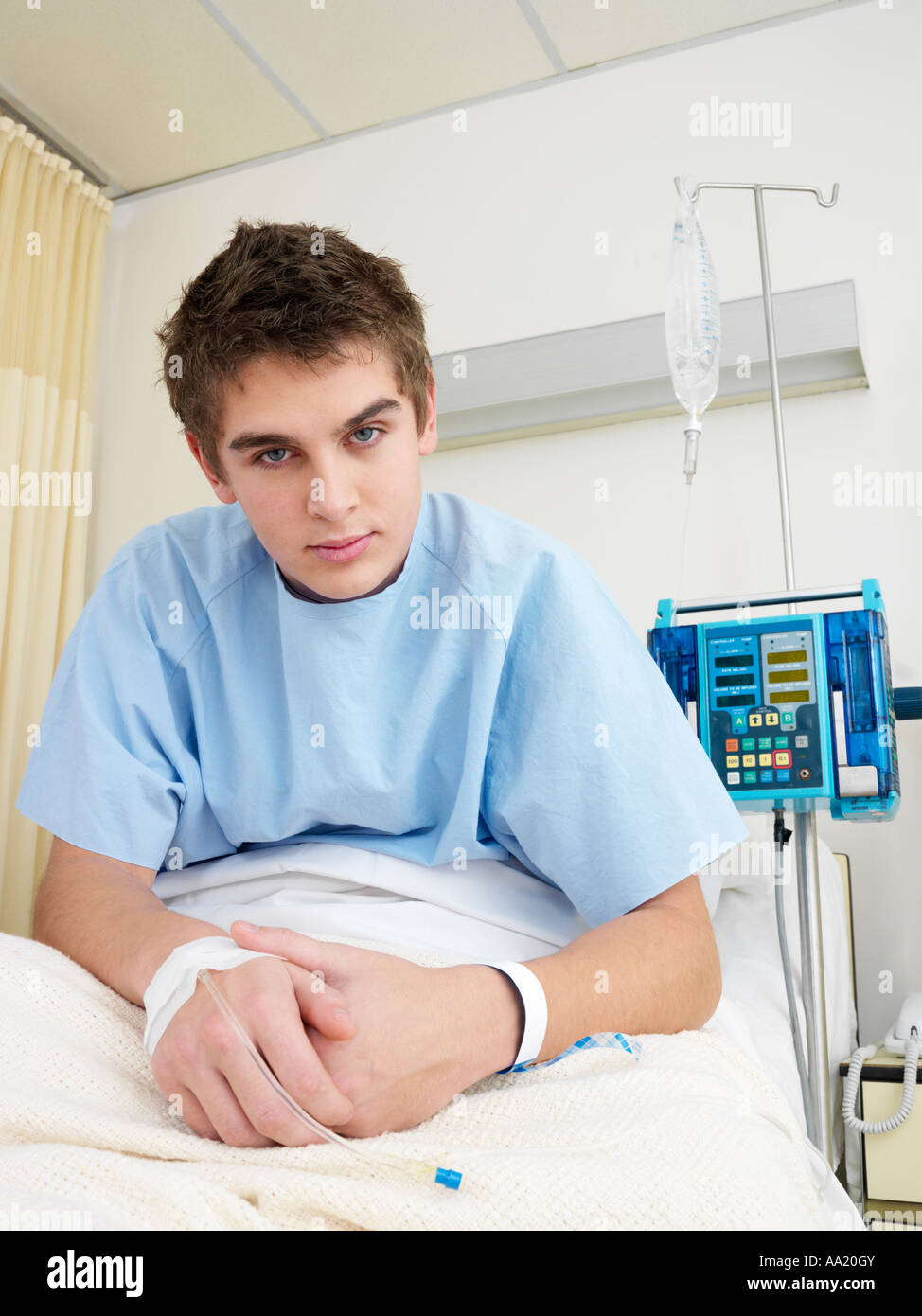 Man hospital gown leaning forward hi-res stock photography and images ...