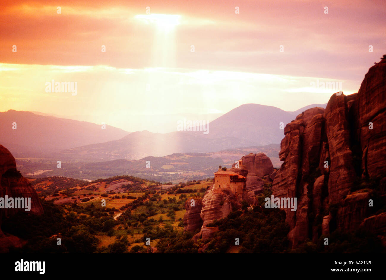 Meteora monasteries at sunset, Rousanou Monastery with sunbeam, Meteora ...