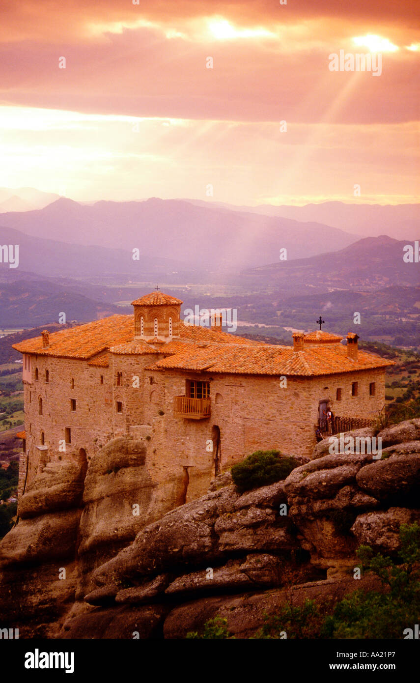 Meteora monasteries at sunset, Rousanou Monastery with sunbeam, Meteora ...
