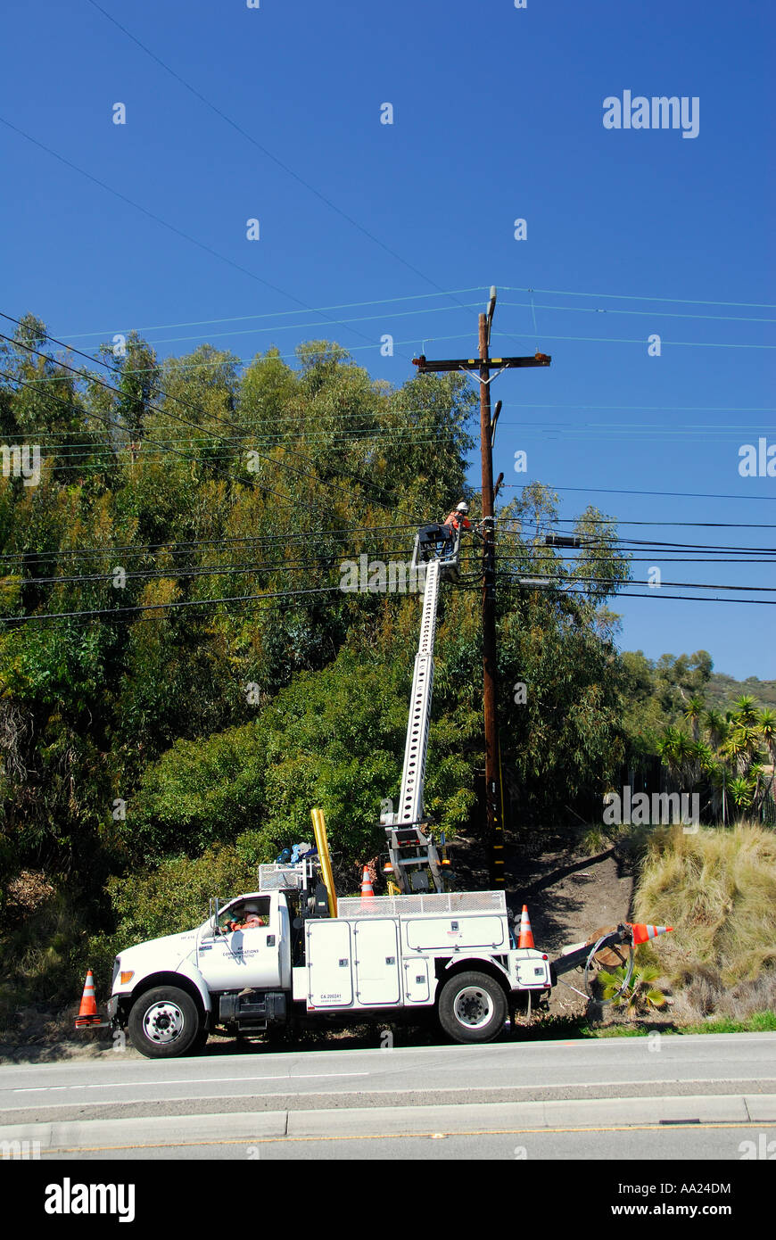 Telecom engineers maintaining cable TV wires Stock Photo - Alamy