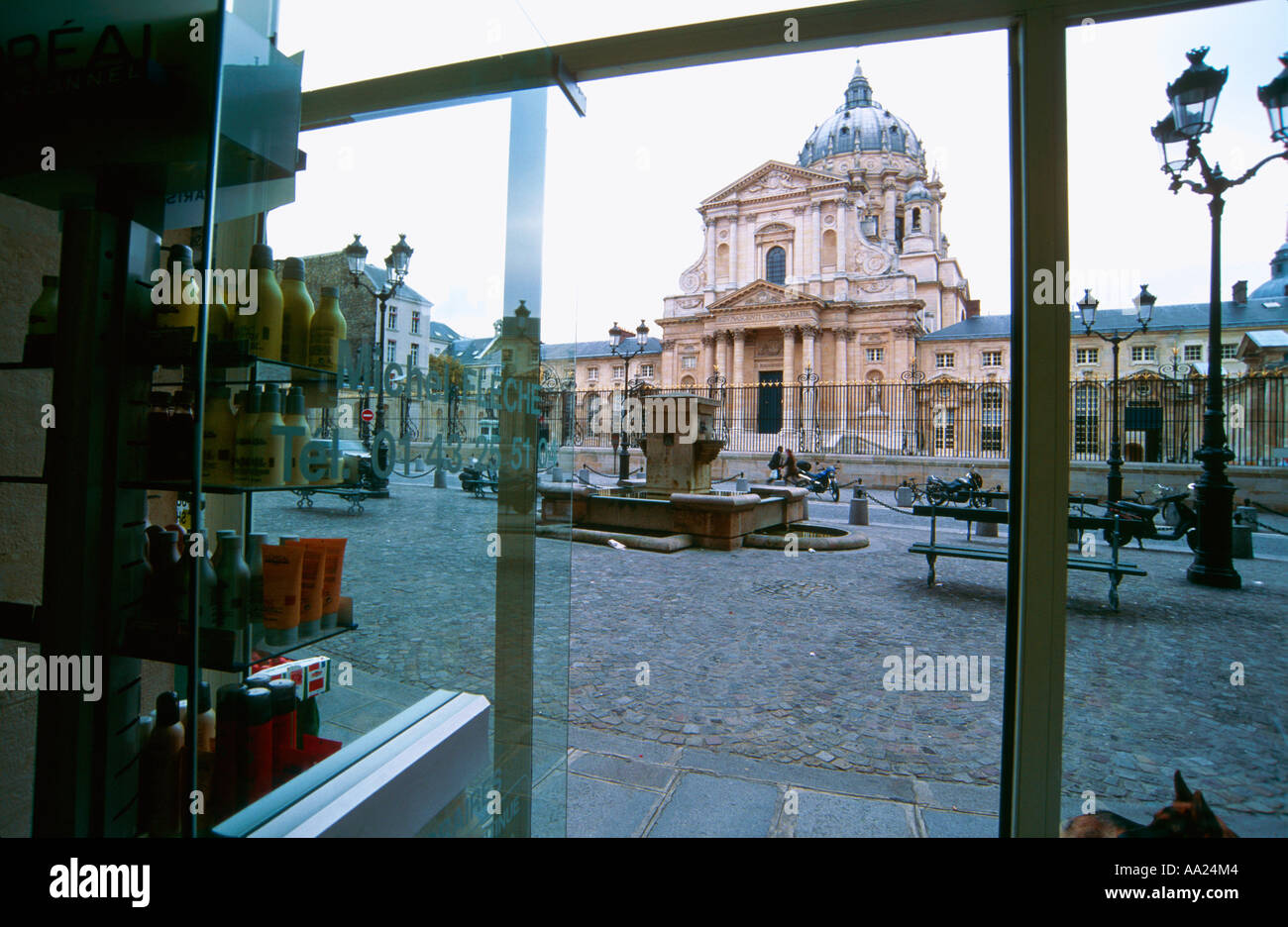 France, Paris, Baroque church seen through barber shop window Stock ...