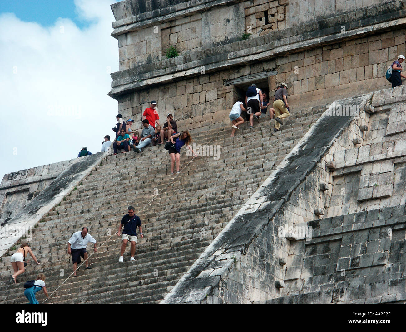Tourists climbing the great pyramide of Chichen Itza, Mexico Stock ...