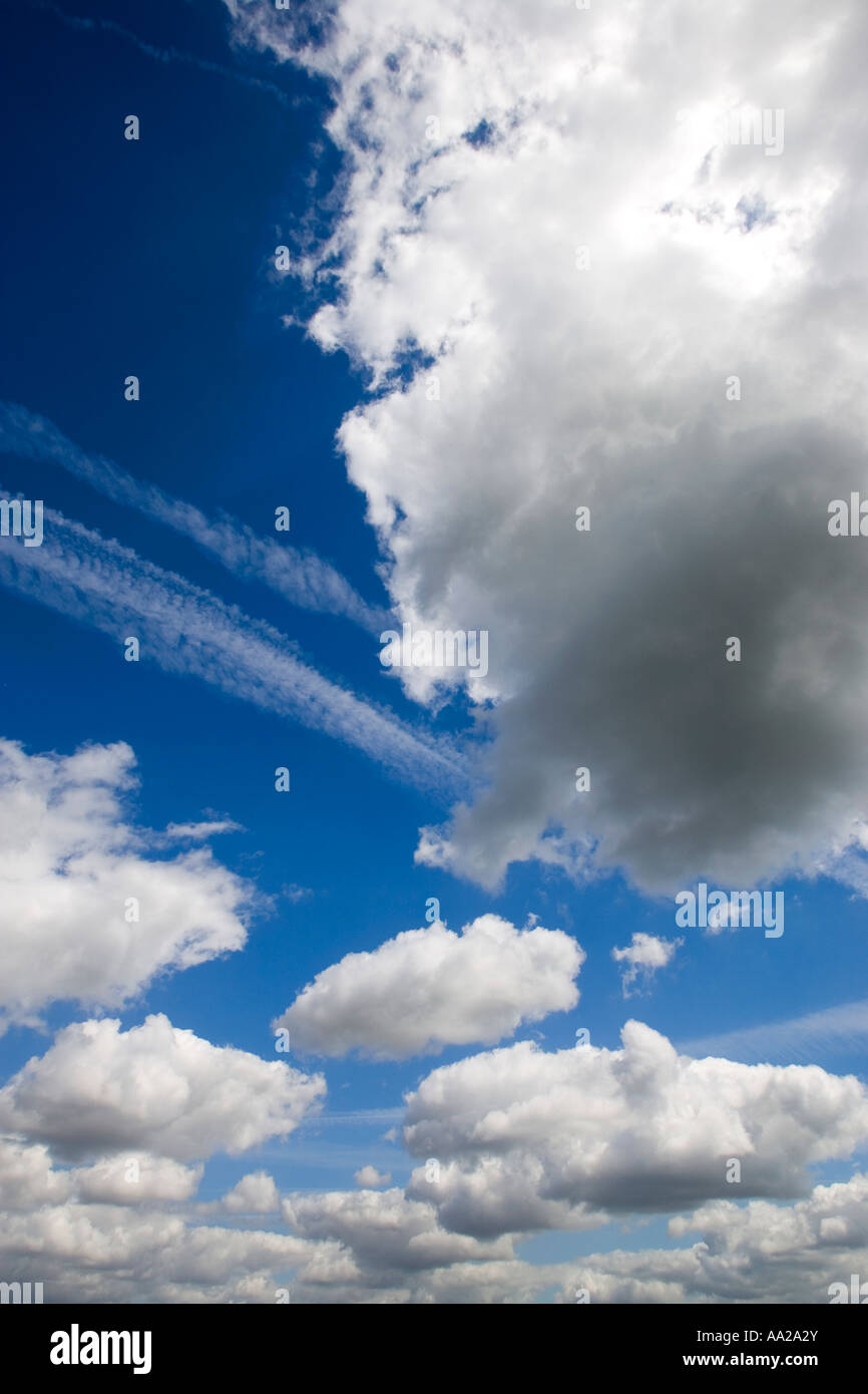 Blue sky with fluffy white clouds Stock Photo - Alamy