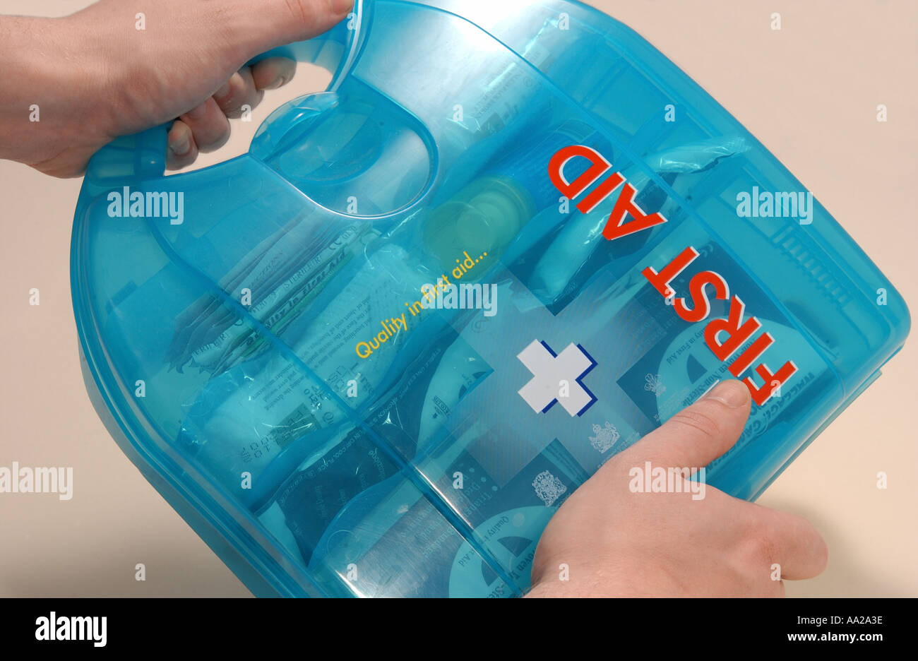 hands holding first aid kit Stock Photo - Alamy