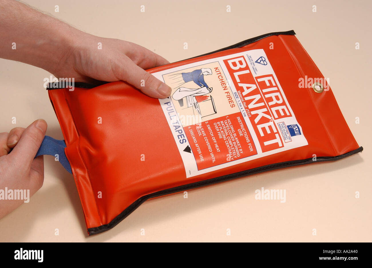 hands holding a fire blanket Stock Photo - Alamy