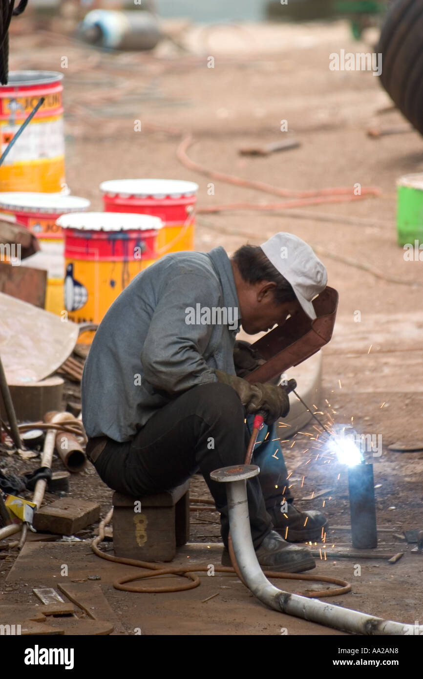 Shipyard welder working with arc welder Stock Photo - Alamy