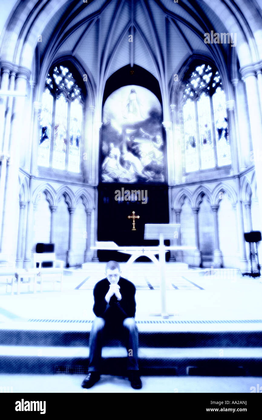 Man sat inside church at the alter Stock Photo - Alamy
