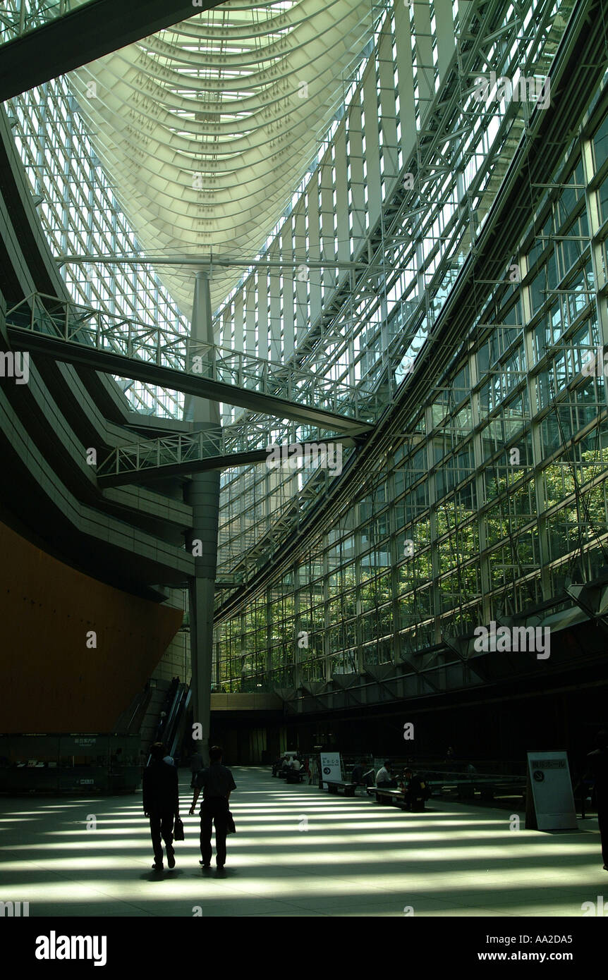 Tokyo International Forum interior, Tokyo. Interior view with figures ...