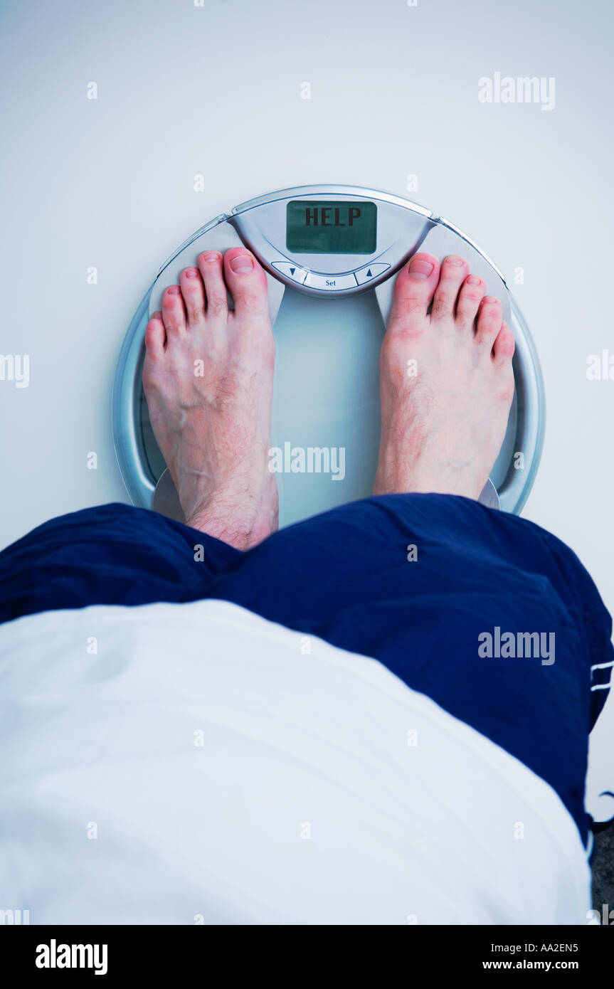 Overweight man scale hi-res stock photography and images - Alamy