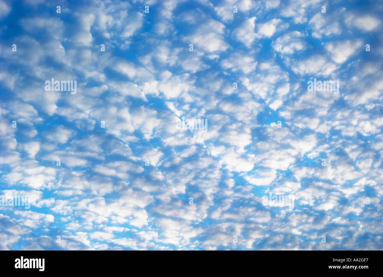 White Cirrocumulus clouds against blue sky Stock Photo - Alamy