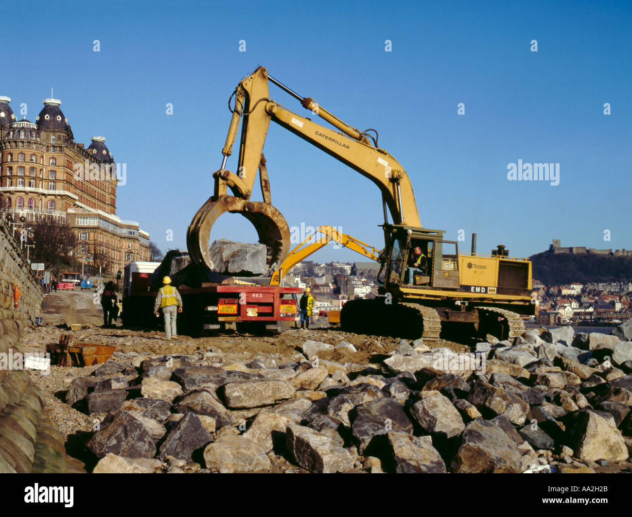 Placing boulder protection to the base of a cliff, Scarborough, North ...